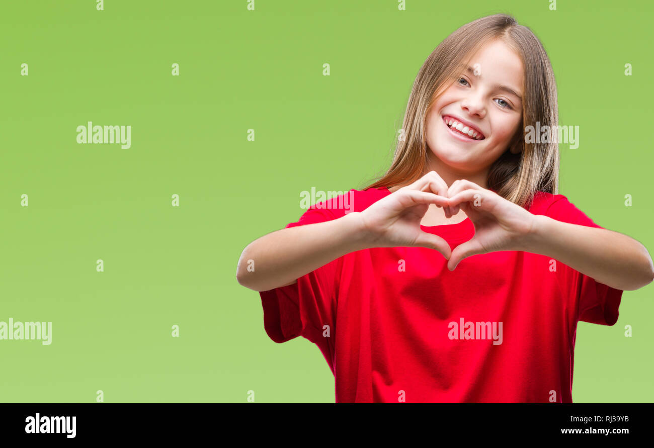 Young beautiful girl over isolated background smiling in love showing ...