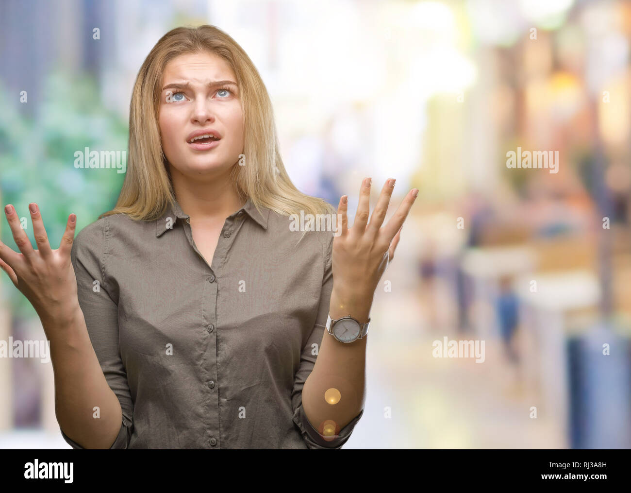 Young caucasian business woman over isolated background crazy and mad ...