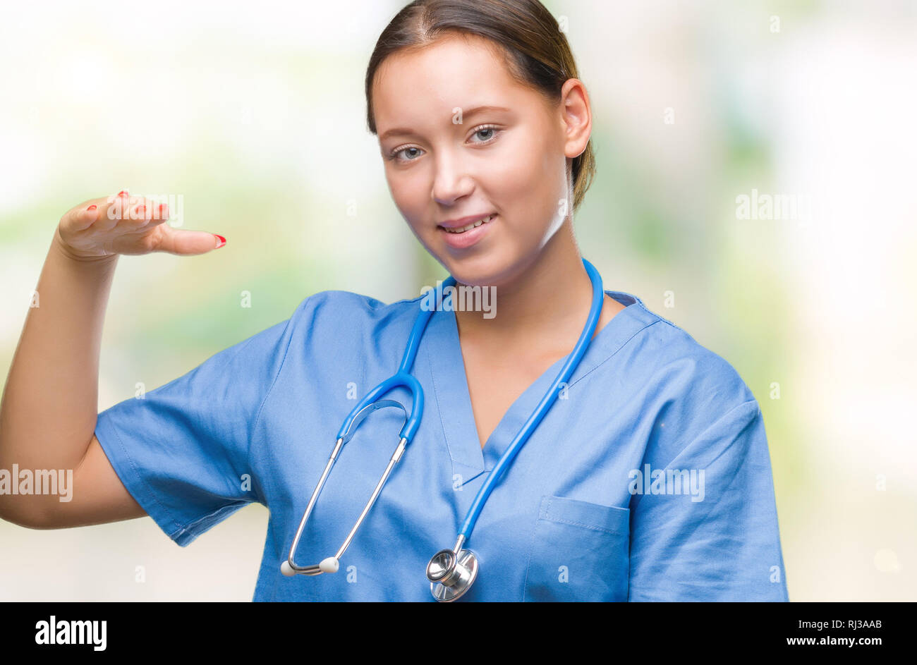 Young caucasian doctor woman wearing medical uniform over isolated ...