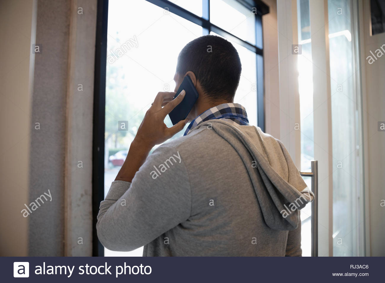 Man through window holding hi-res stock photography and images - Alamy