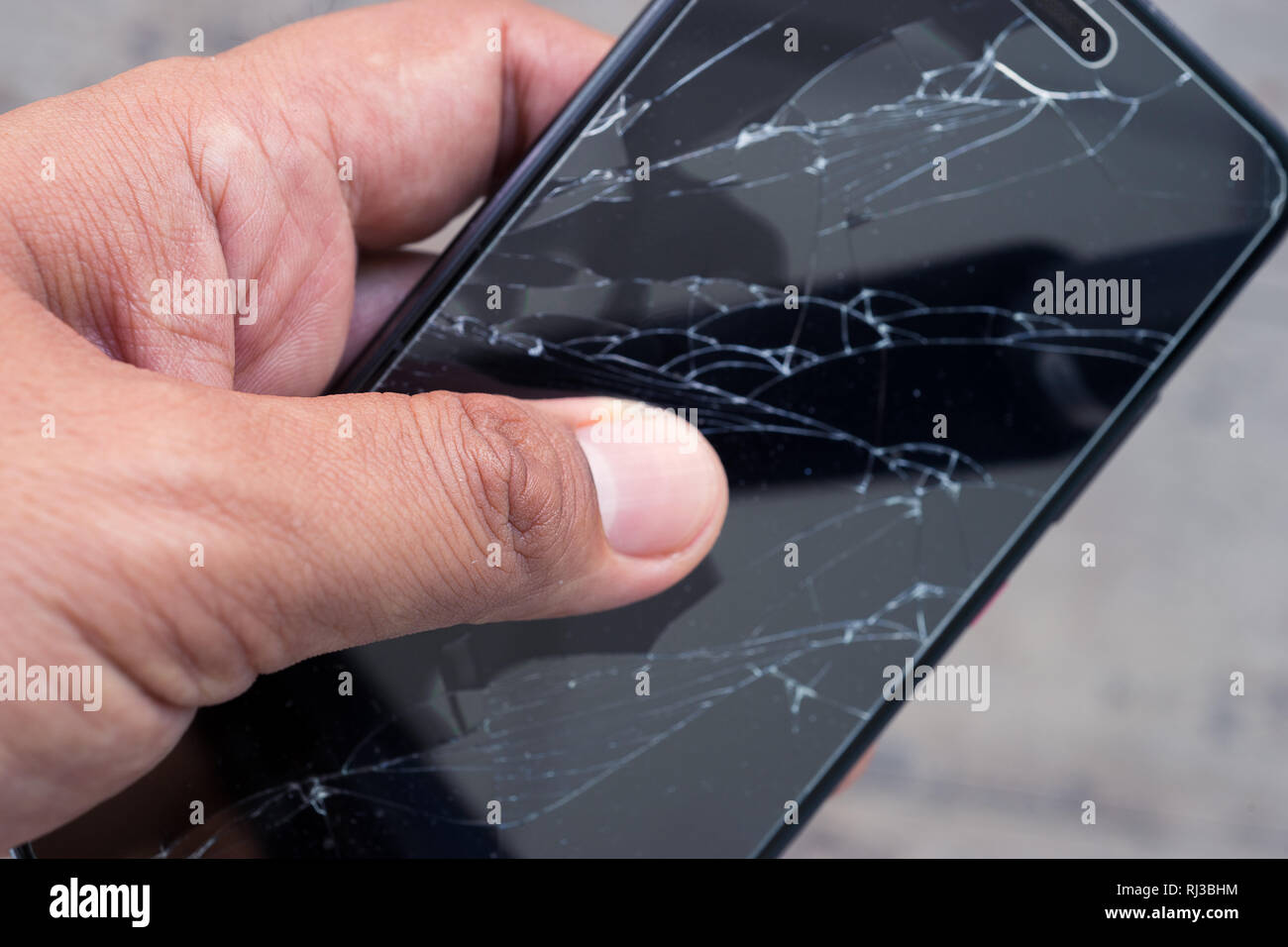 Iphone glass broken hand hi-res stock photography and images - Alamy