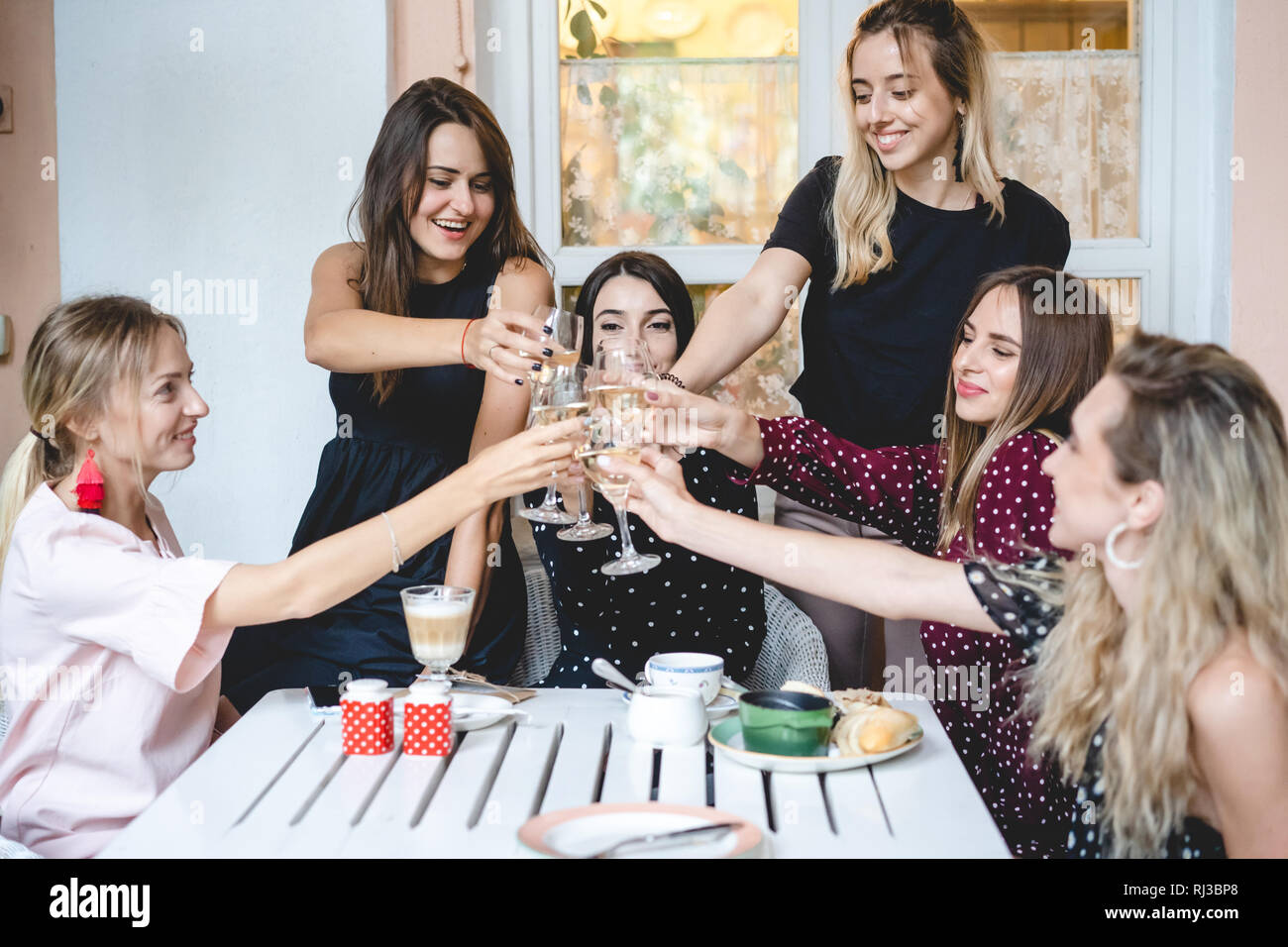 Six girls at the table Stock Photo - Alamy