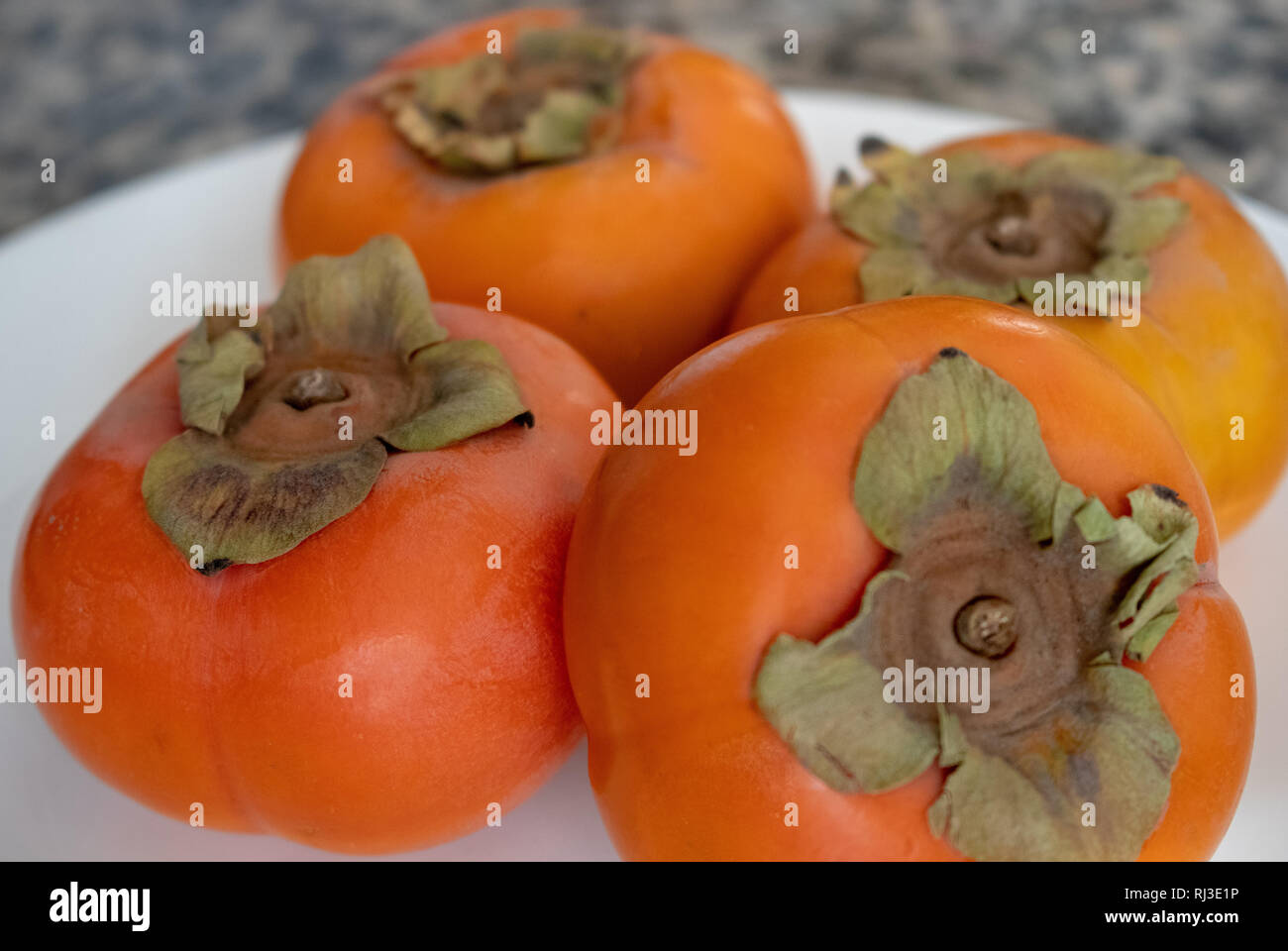 Organic persimmons hi-res stock photography and images - Alamy