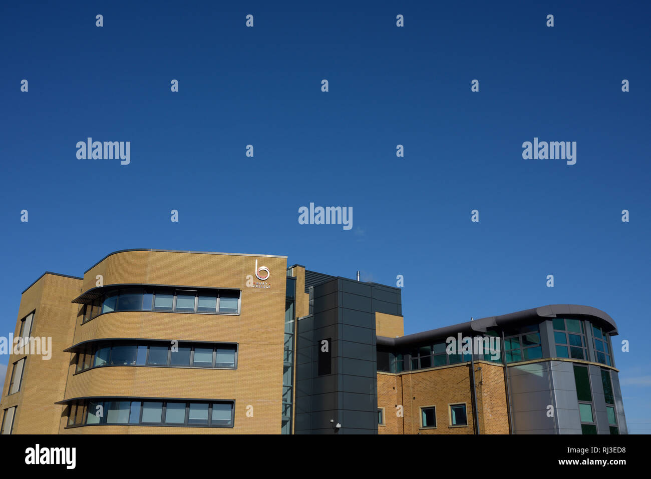 Modern building with curved facade, buff brickwork and curved ribbon ...