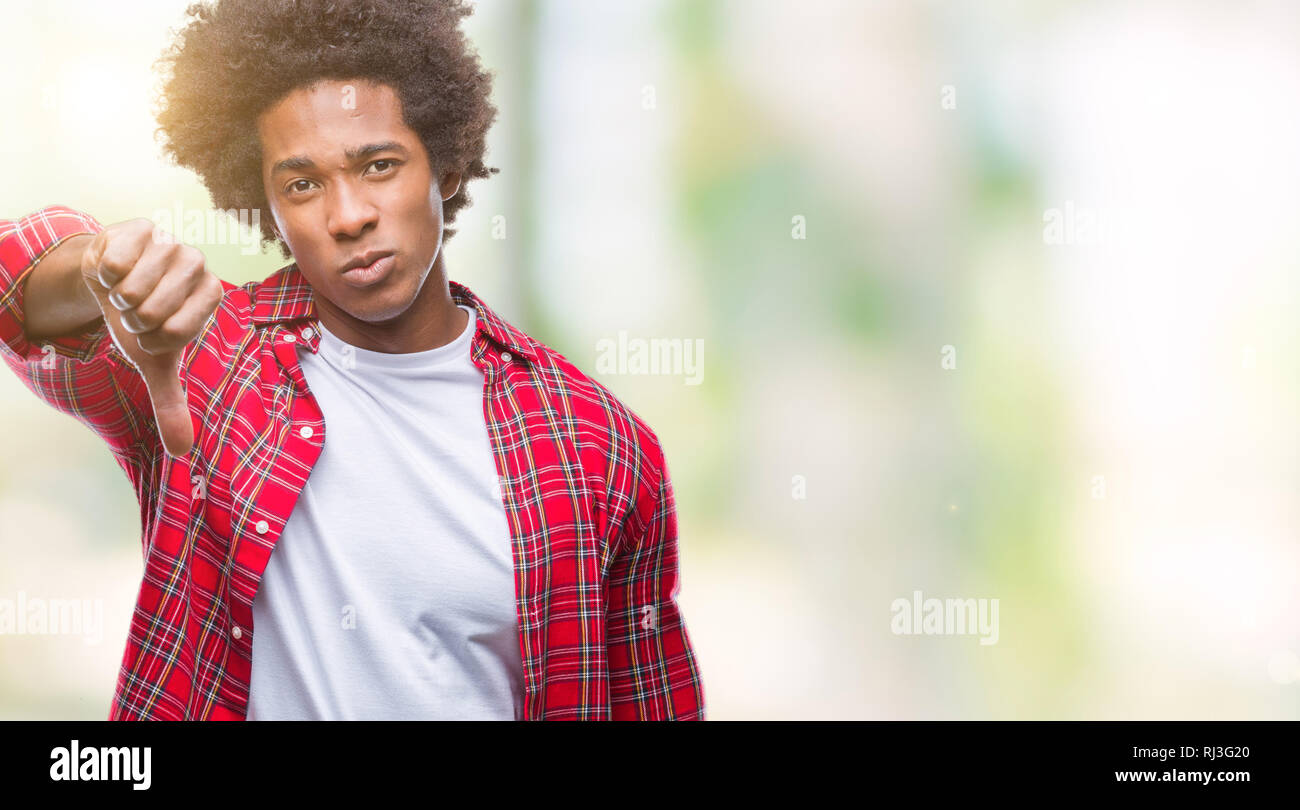 Afro american man over isolated background looking unhappy and angry ...