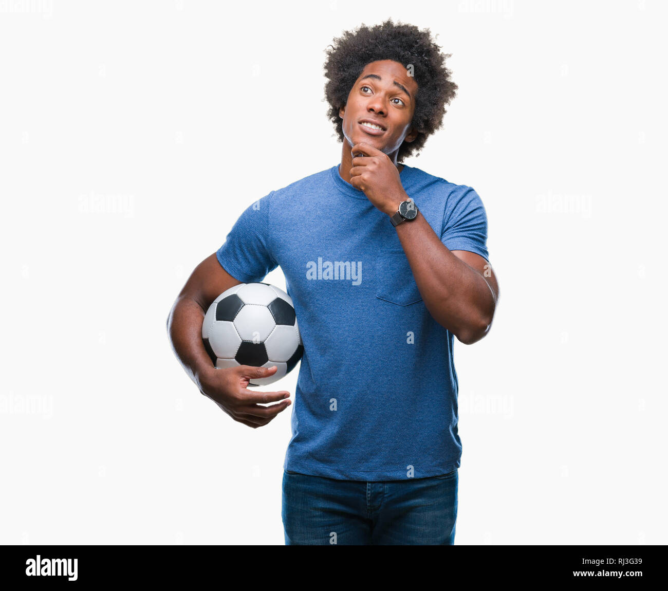 Afro american man holding football ball over isolated background ...