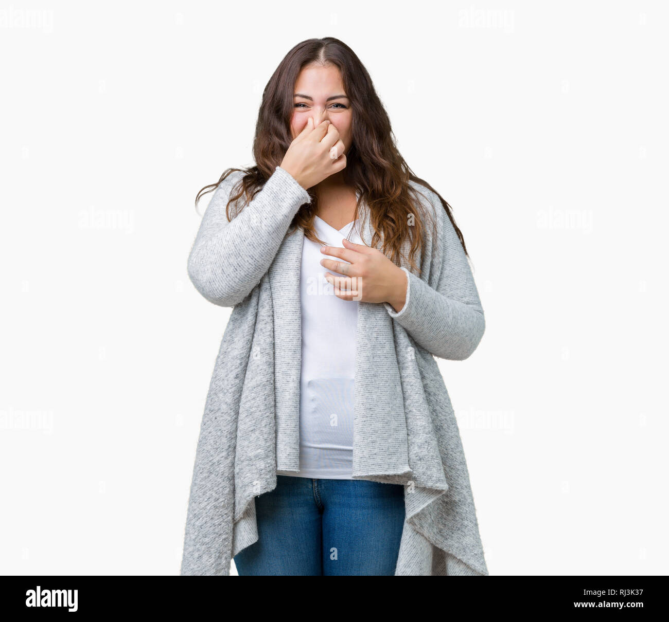 Beautiful plus size young woman wearing winter jacket over isolated ...