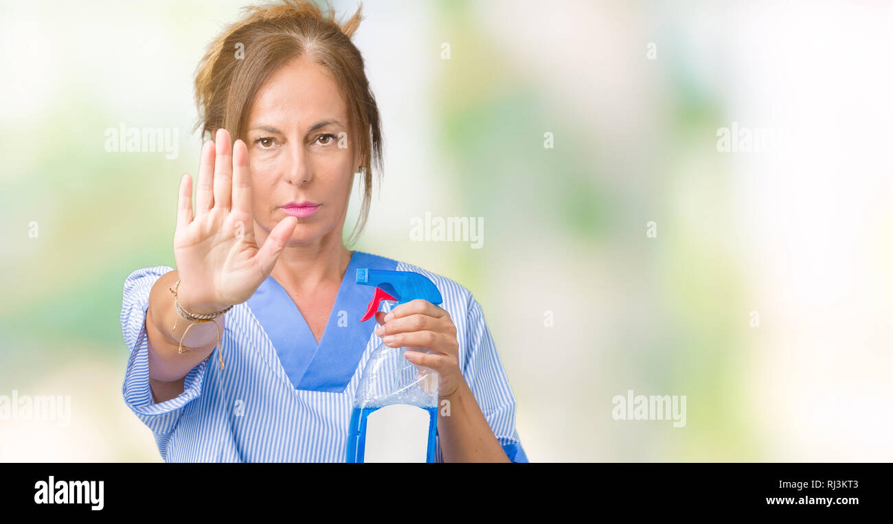 Middle age brunette cleaner woman wearing housework uniform over ...
