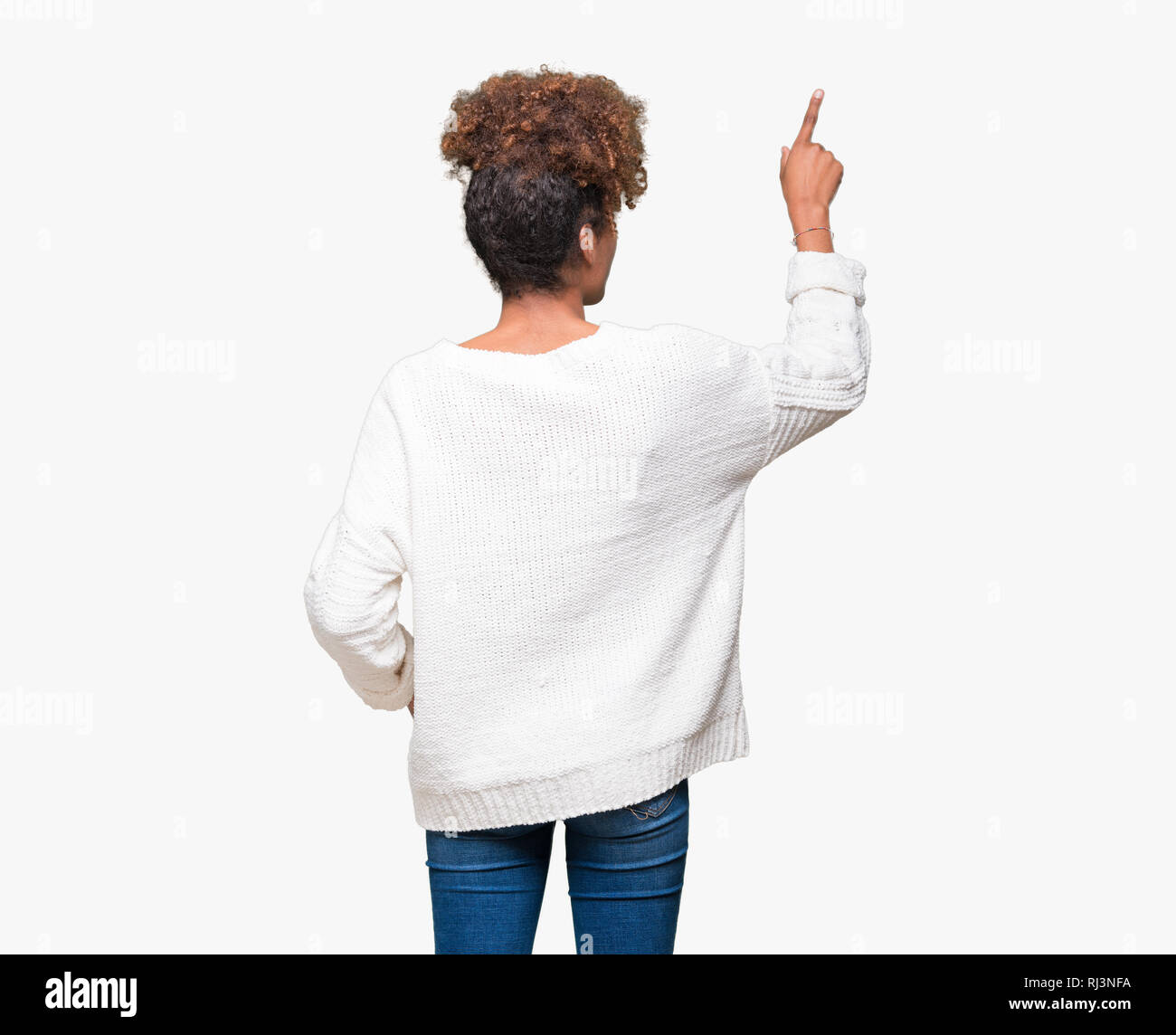 Beautiful young african american woman wearing winter sweater over ...