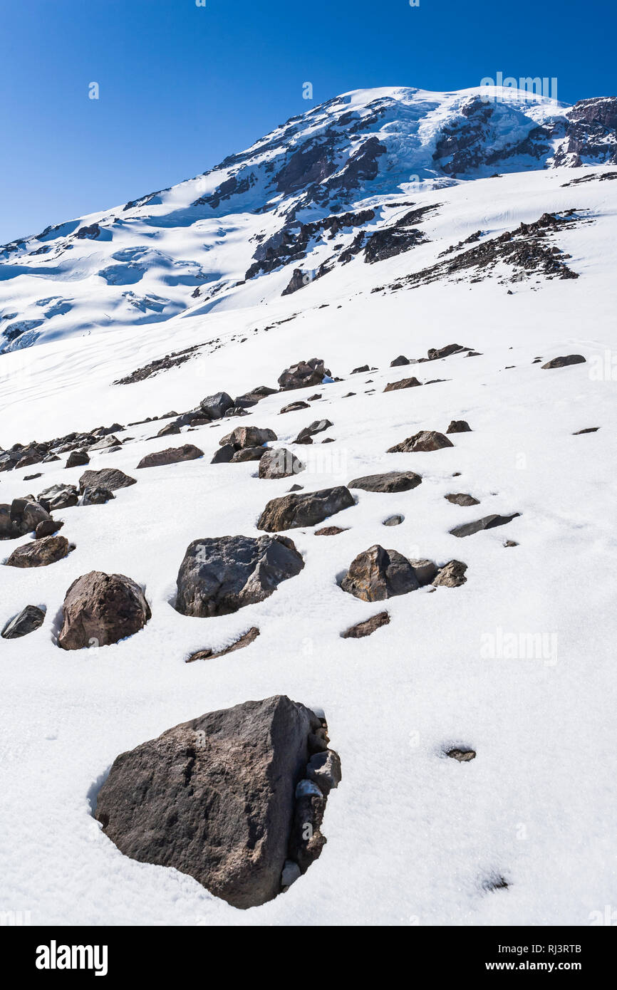 Mount Rainier on a sunny blue sky day. In the distance are the ski ...