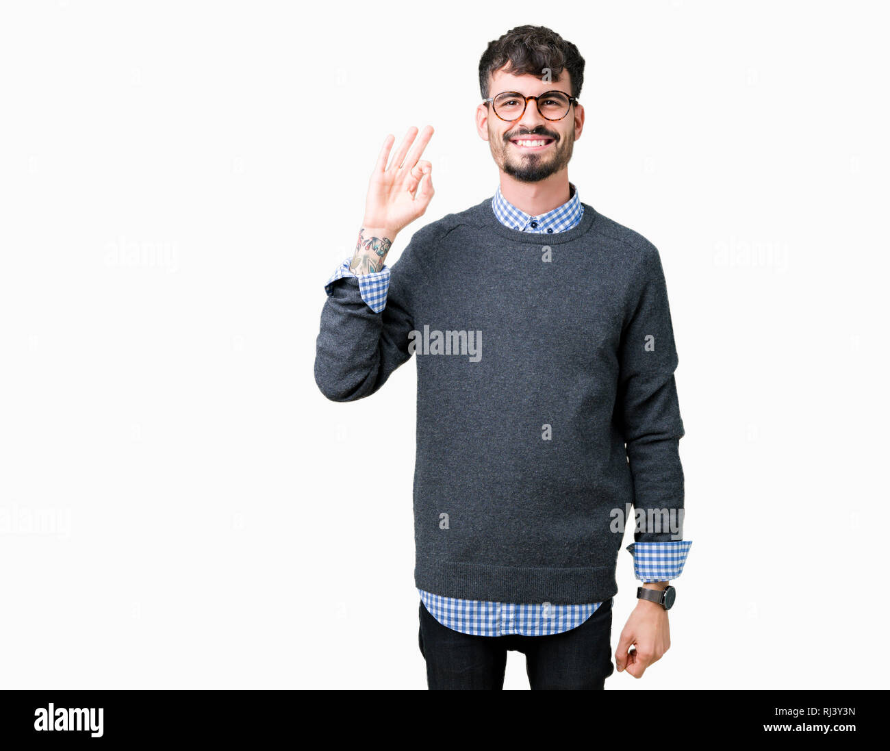 Young handsome smart man wearing glasses over isolated background ...