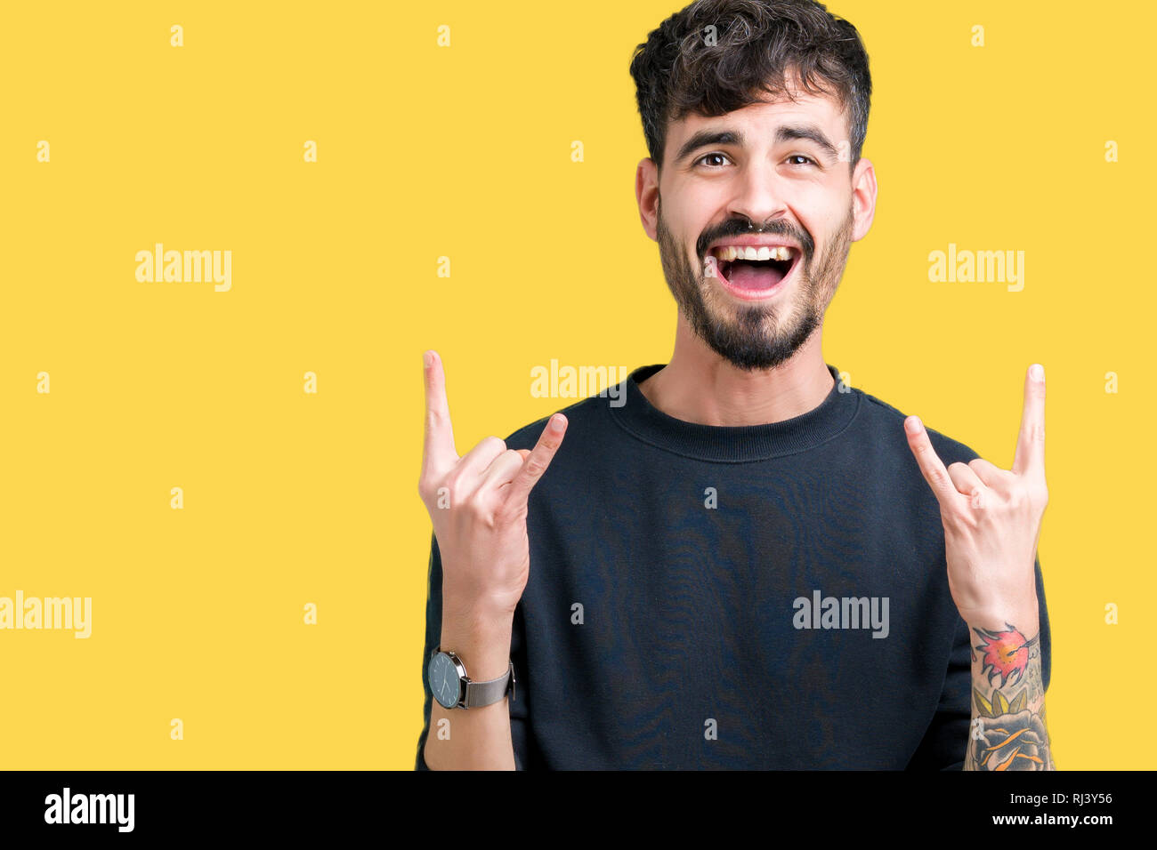 Young handsome man over isolated background shouting with crazy ...