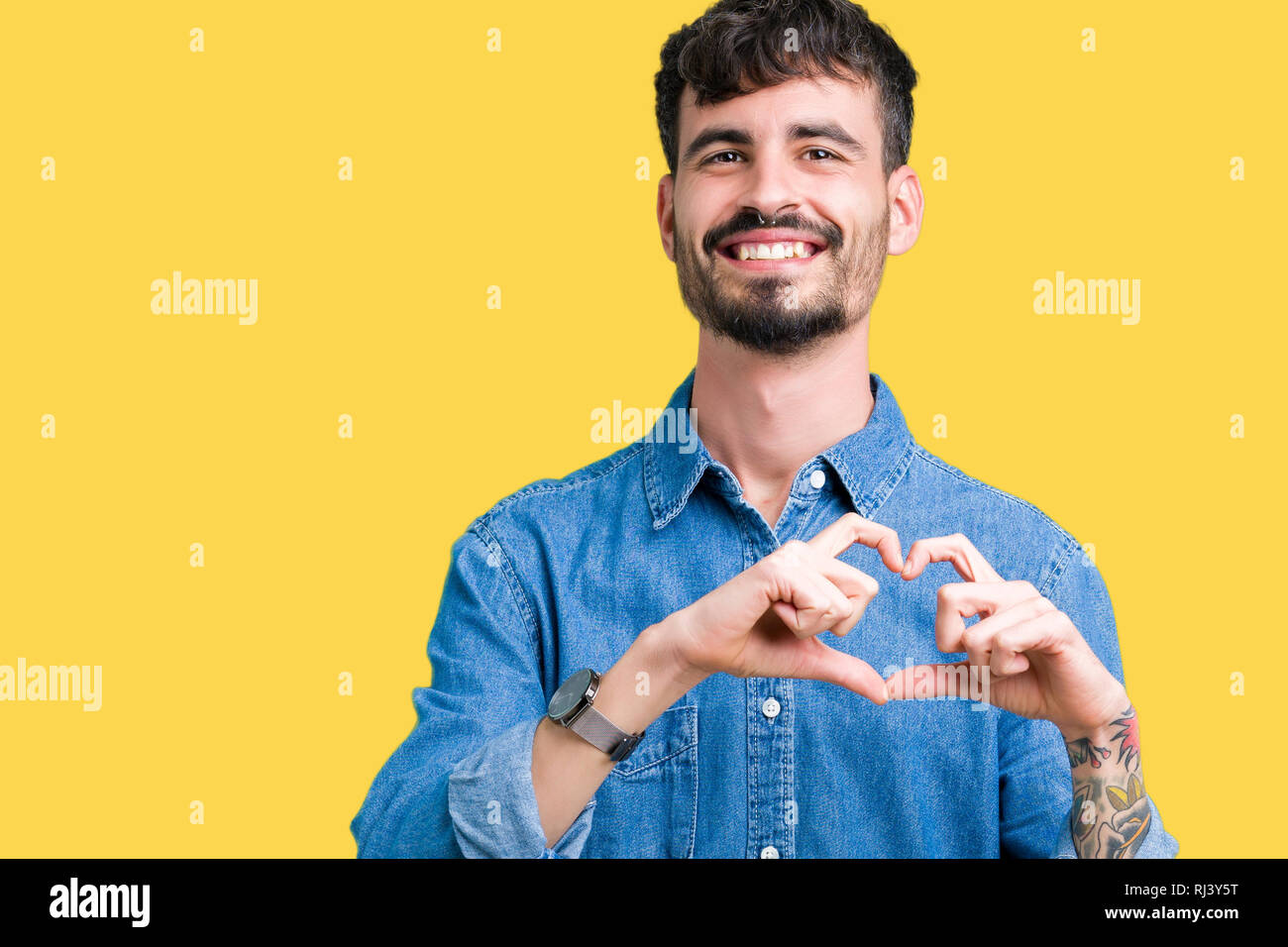 Young handsome man over isolated background smiling in love showing ...