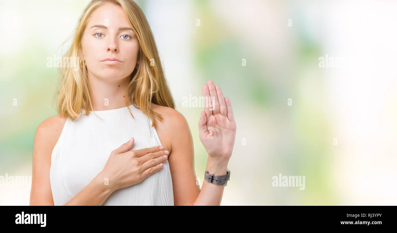 Beautiful young elegant woman over isolated background Swearing with ...