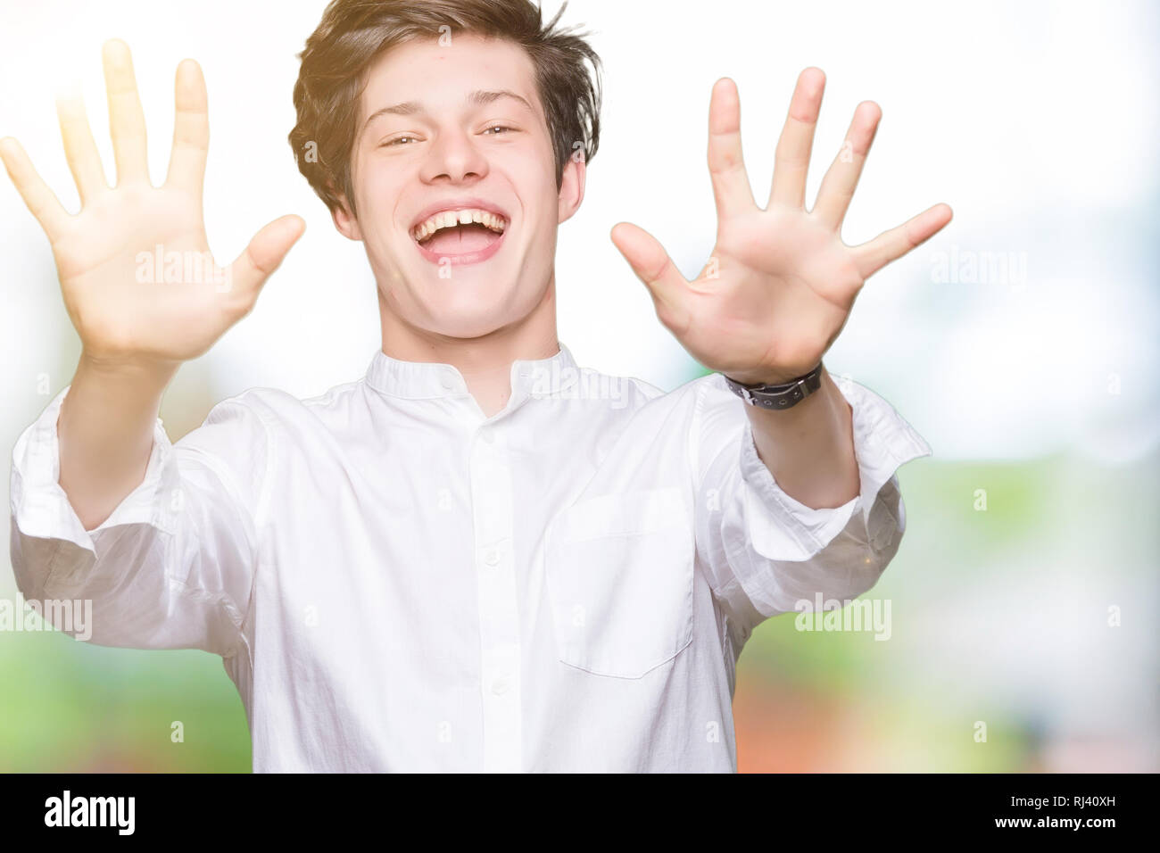Young handsome business man over isolated background showing and ...