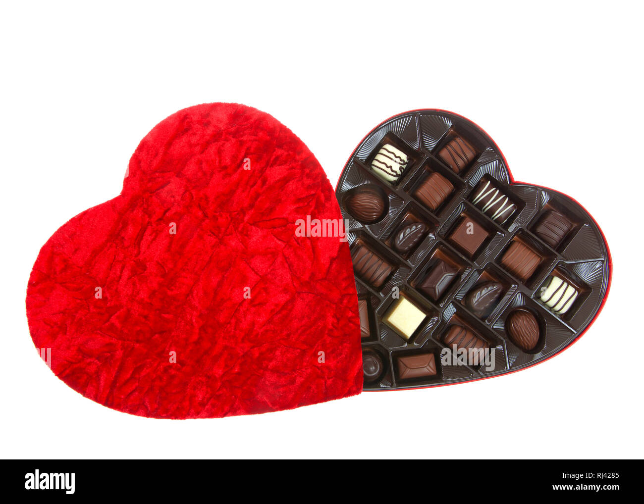 Heart shaped box with chocolate candies isolated on white background. A ...
