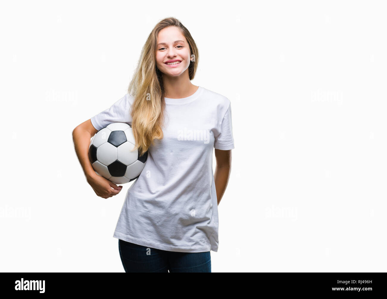 Young beautiful blonde woman holding soccer ball over isolated ...