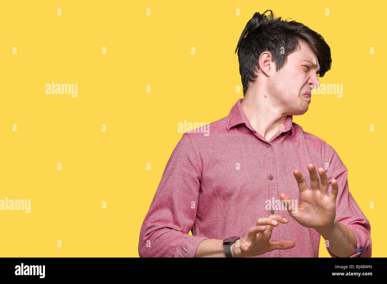 Young handsome business man over isolated background disgusted ...