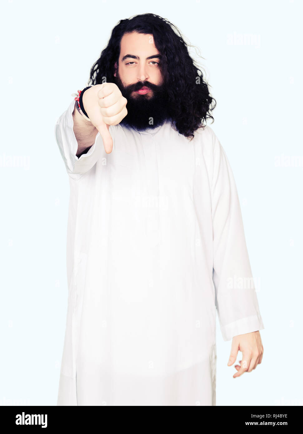 Man wearing Jesus Christ costume looking unhappy and angry showing ...