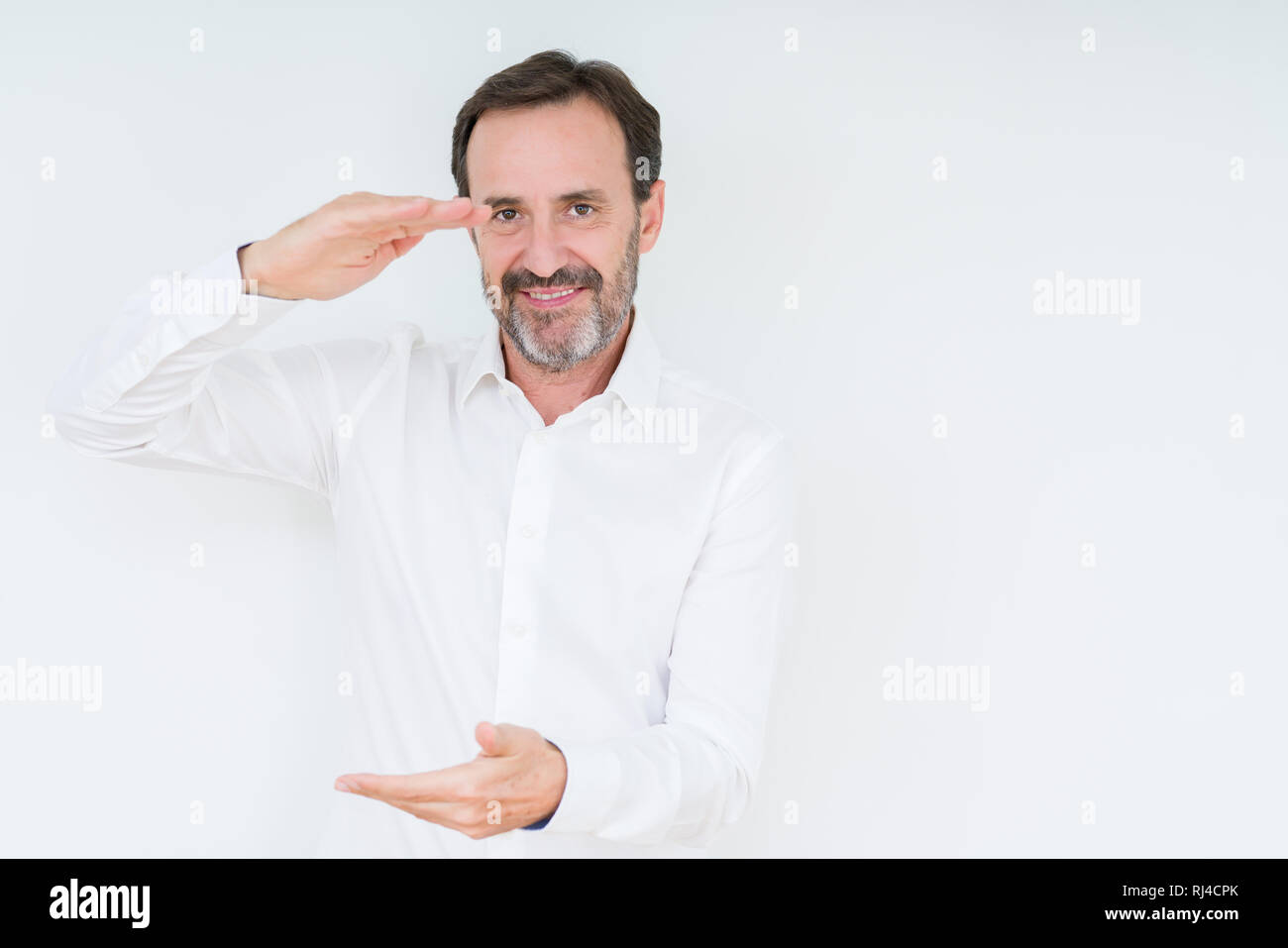 Elegant senior man over isolated background gesturing with hands ...