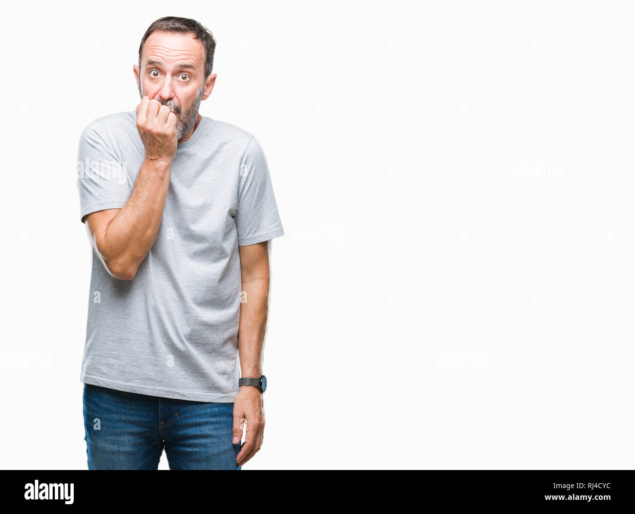 Middle age senior hoary man over isolated background looking stressed ...
