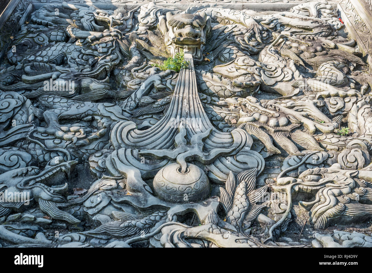 Stone dragon bas-relief sculpture fresco in a buddhist temple in ...