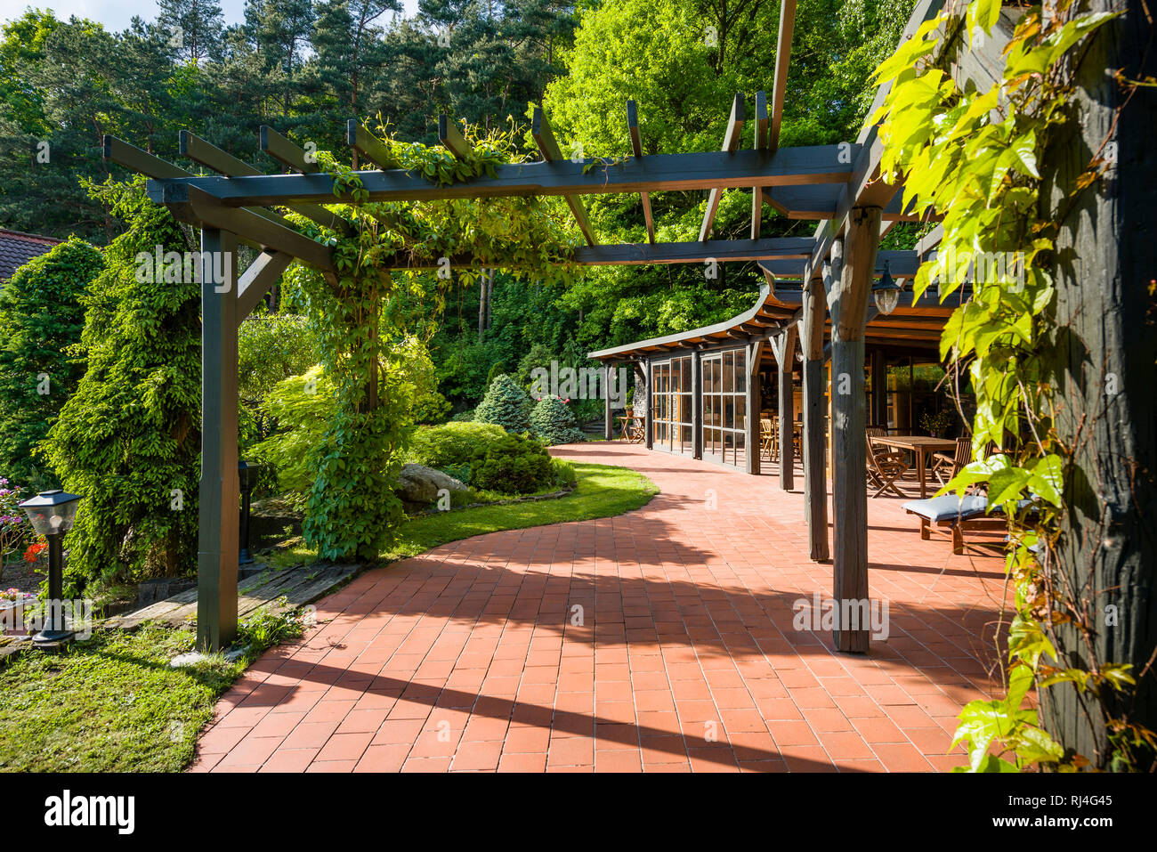 Wooden pergola in old garden Stock Photo - Alamy