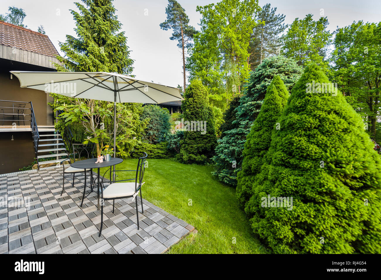 summer terrace with Parasol Stock Photo - Alamy
