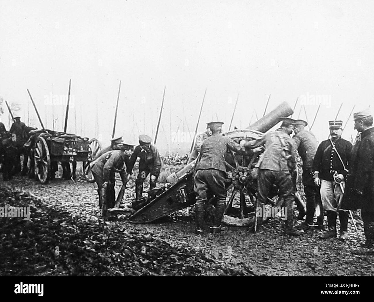 British gunners placing a line of artillery in position during WW1 ...