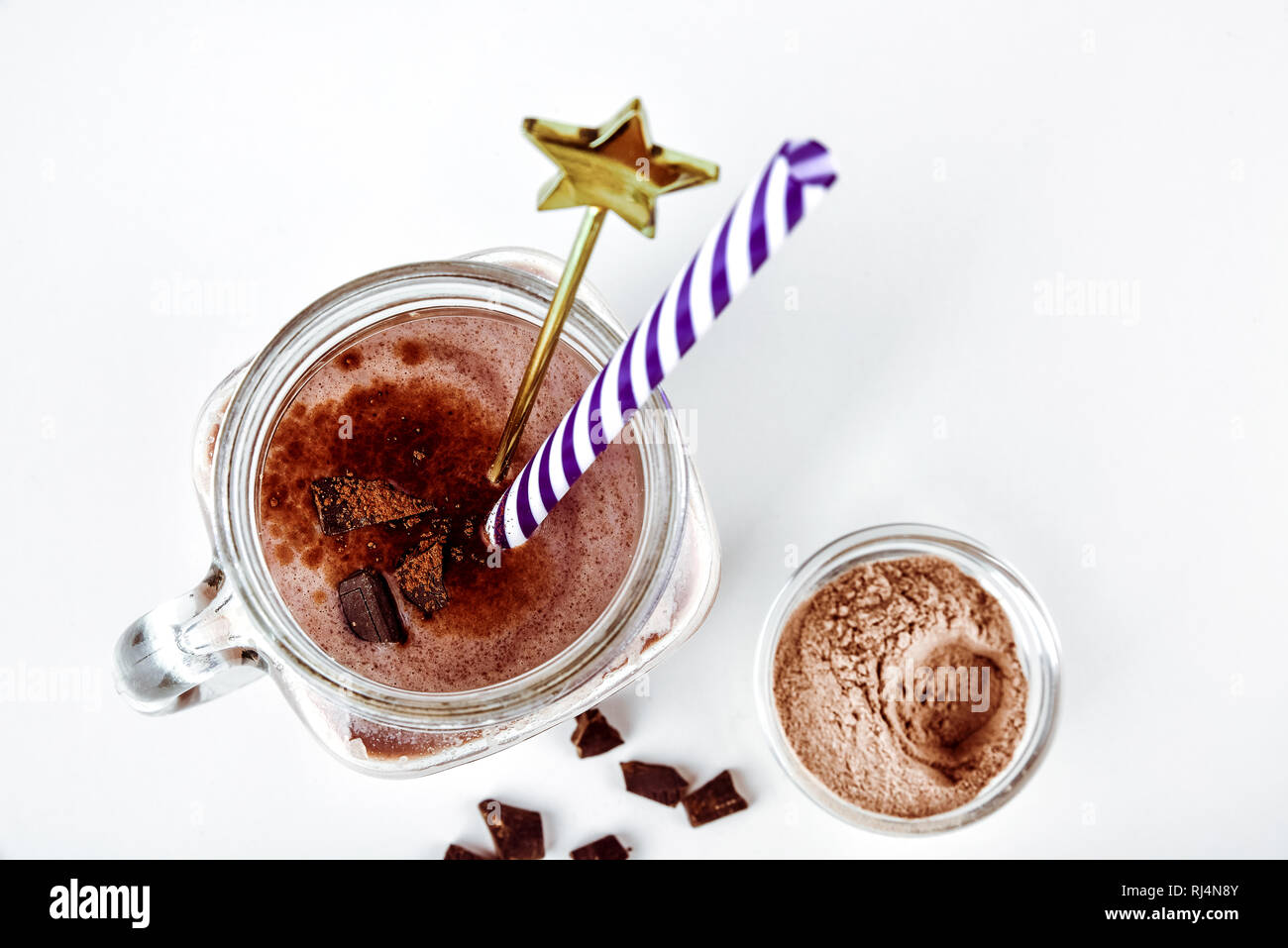 Coffee raf, cocoa, chocolate in a glass jar with straws and decor ...