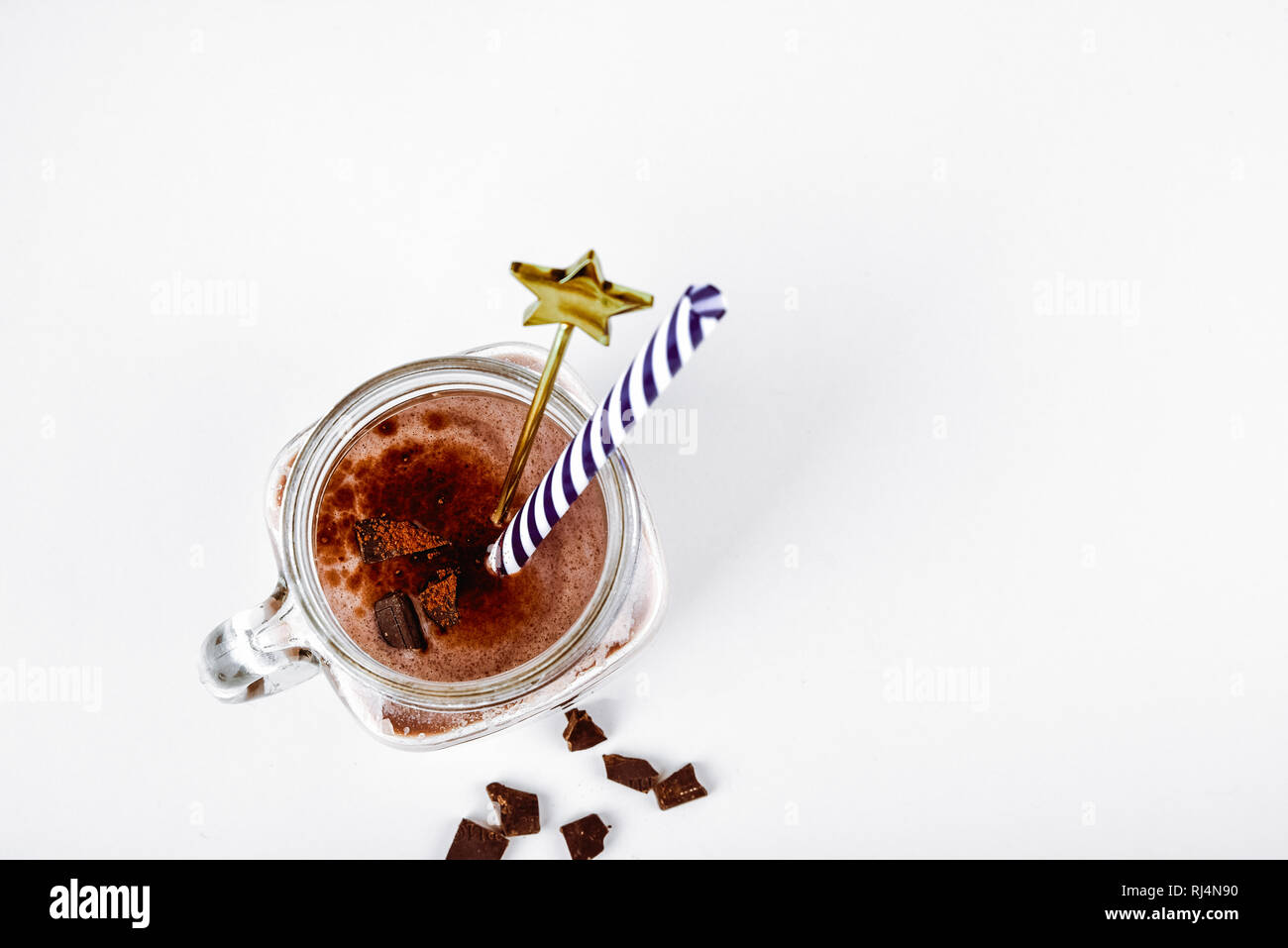 Coffee raf, cocoa, chocolate in a glass jar with straws and decor ...