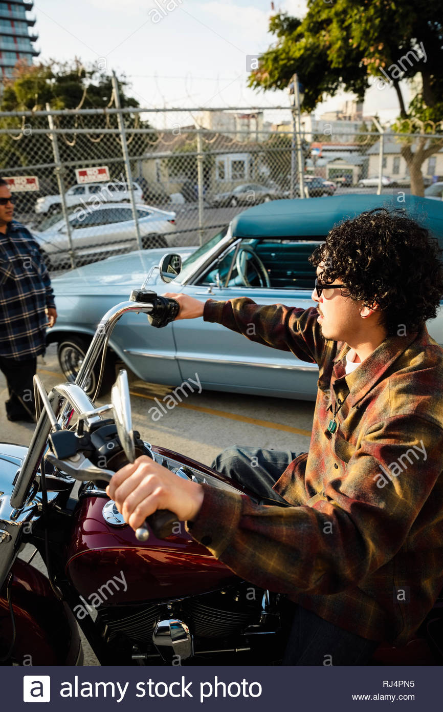 Sitting latinx man hi-res stock photography and images - Alamy