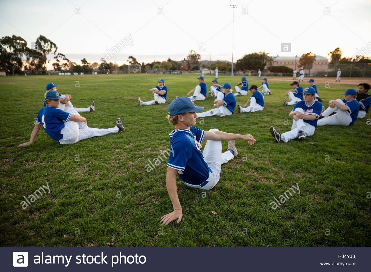 Athlete stretching in grass hi-res stock photography and images - Alamy
