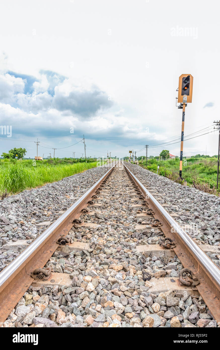 Long straight railroad on concrete sleepers in a rural Stock Photo - Alamy