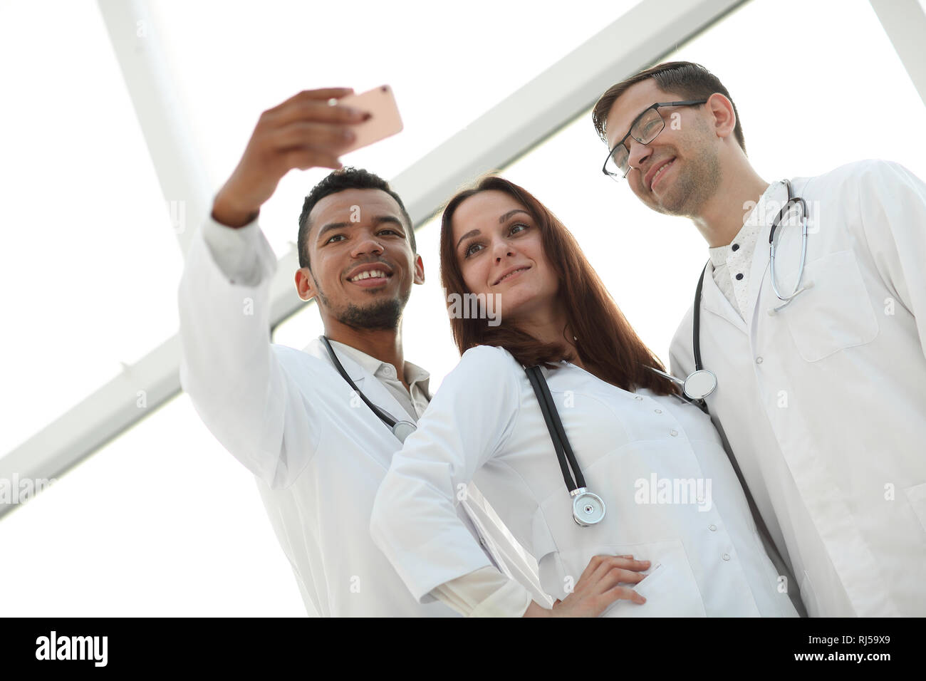 close up.group of medical doctors taking selfies Stock Photo - Alamy