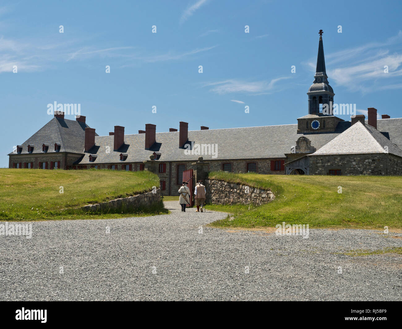 2 figures and main building, Fortress Louisburg, Cape Breton, Canada ...