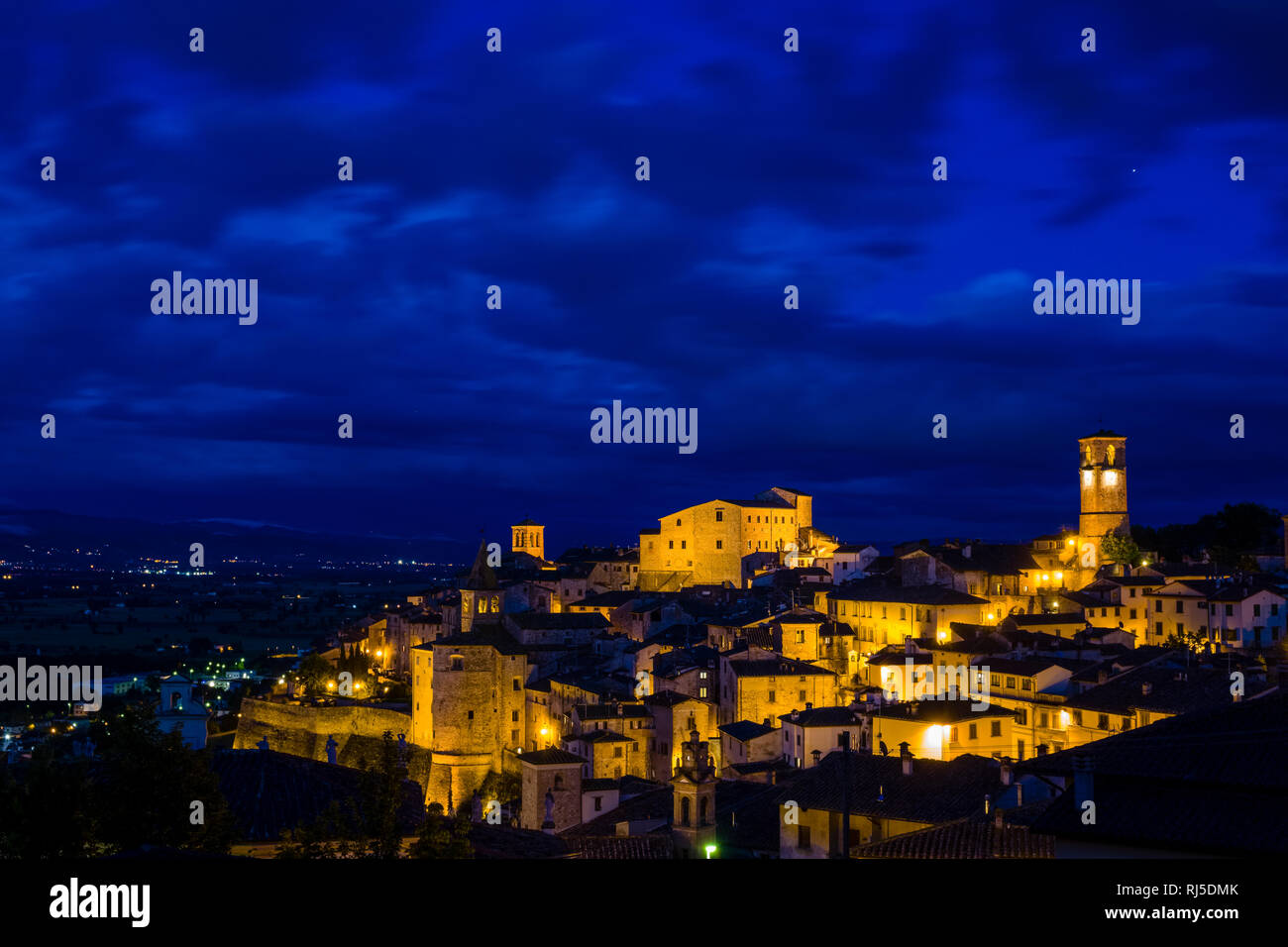 The medieval town located on top of a hill, illuminated at night Stock ...