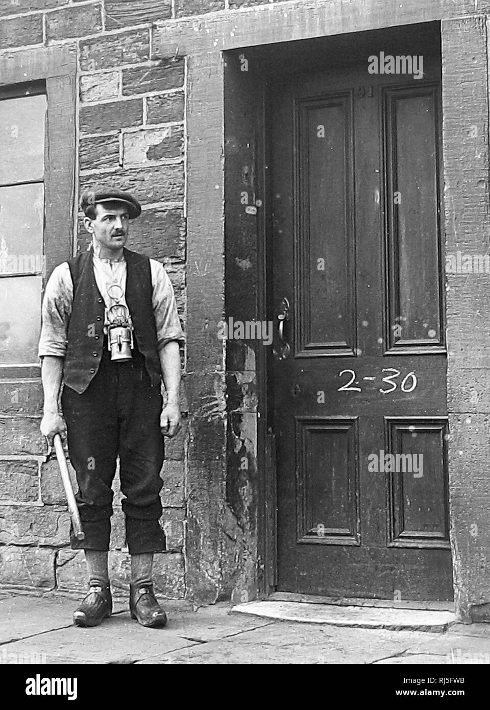 A knocker-up for coal miners Stock Photo - Alamy