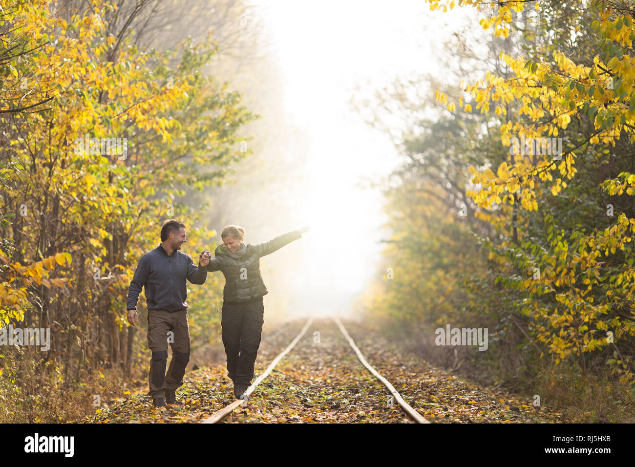 Woman walking along railroad hi-res stock photography and images - Alamy