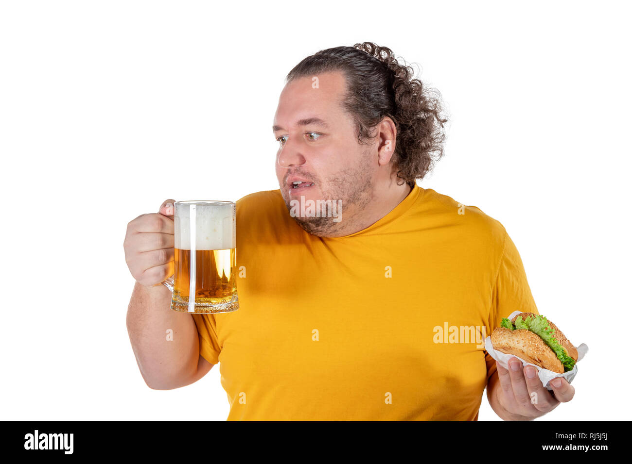 Funny fat man eating burger and drinking alcohol beverage Stock Photo ...
