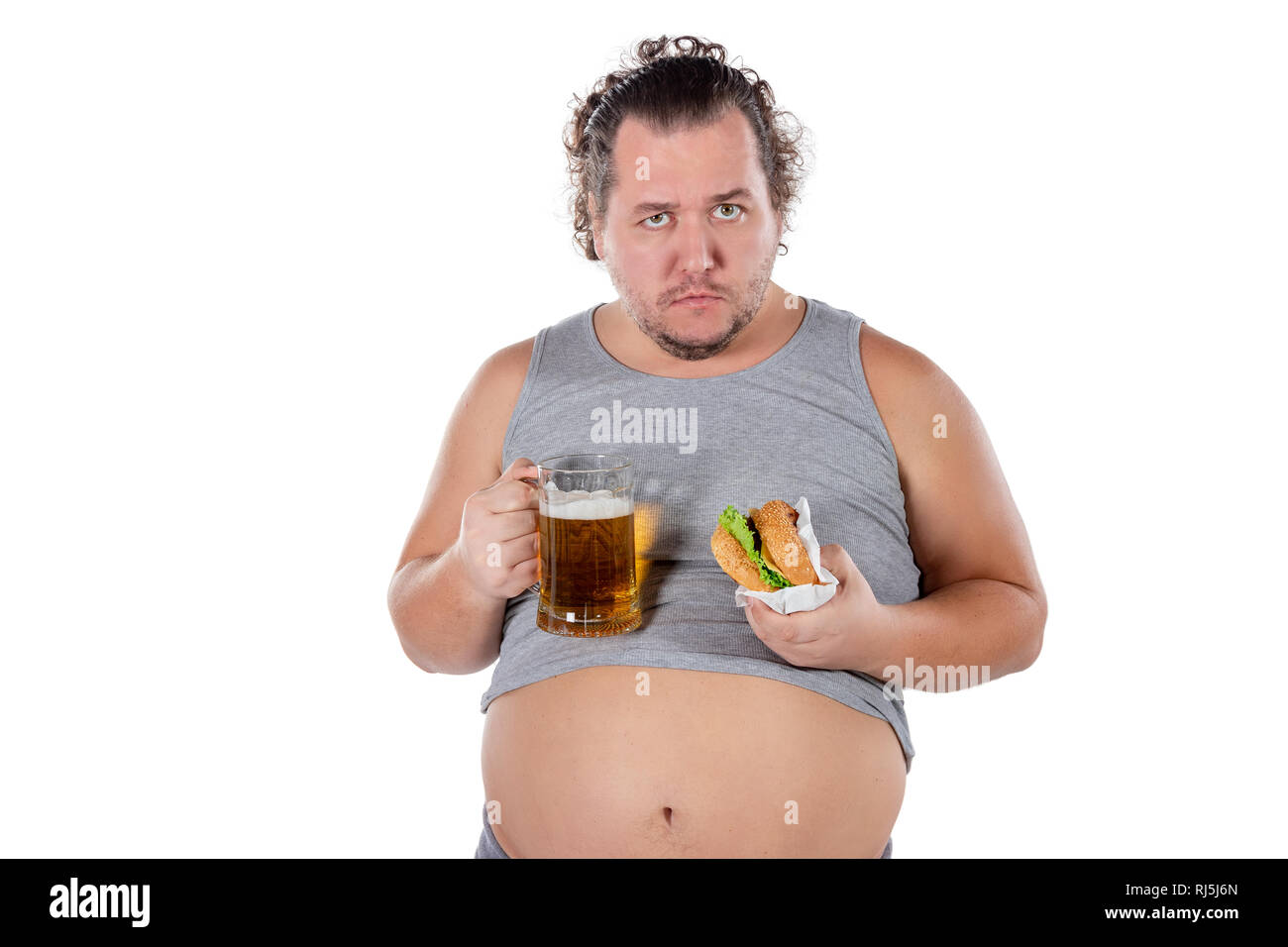 Funny fat man eating burger and drinking alcohol beverage Stock Photo ...