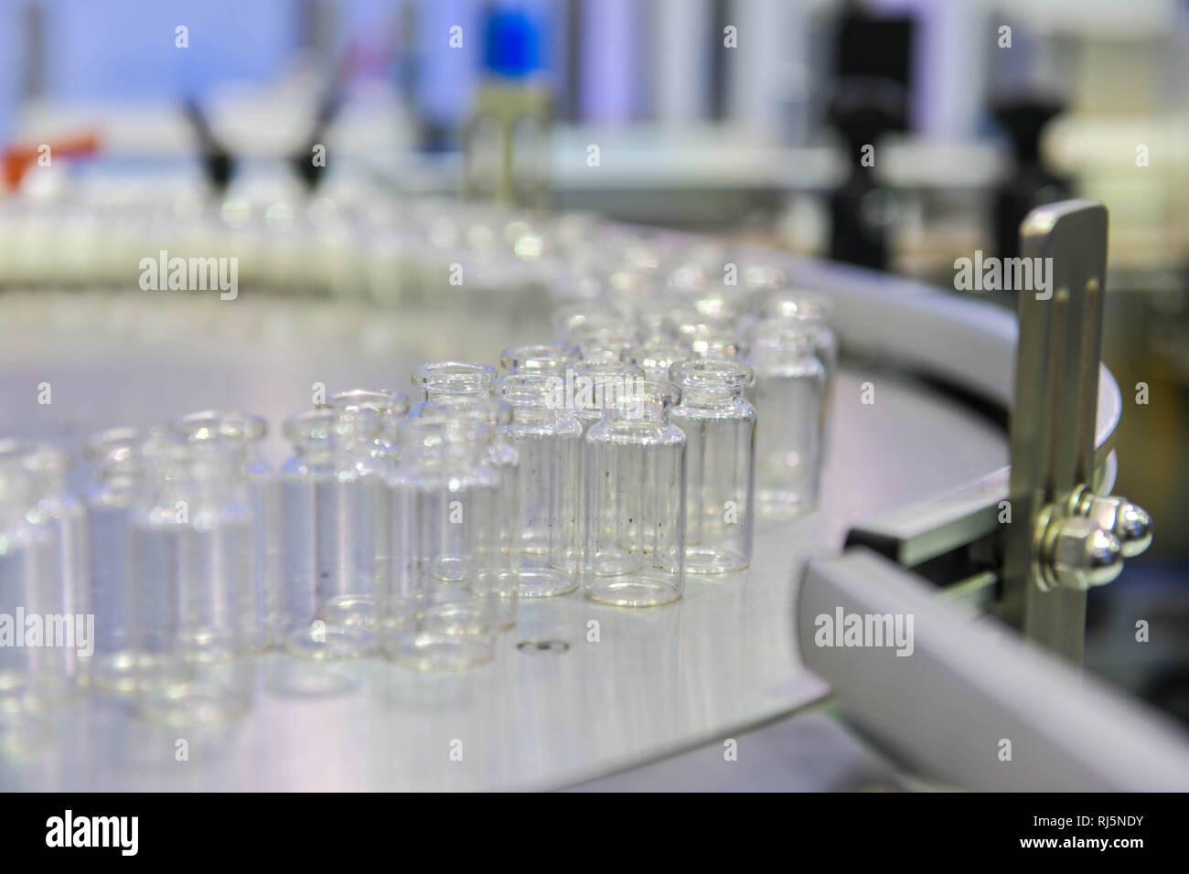 Clear Glass bottles transfer on Automated conveyor systems industrial ...