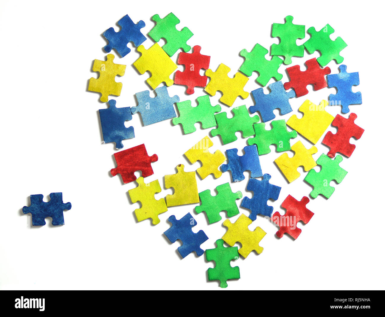 Colourful jigsaw puzzle and alphabet tiles with AUTISM word. Autism ...