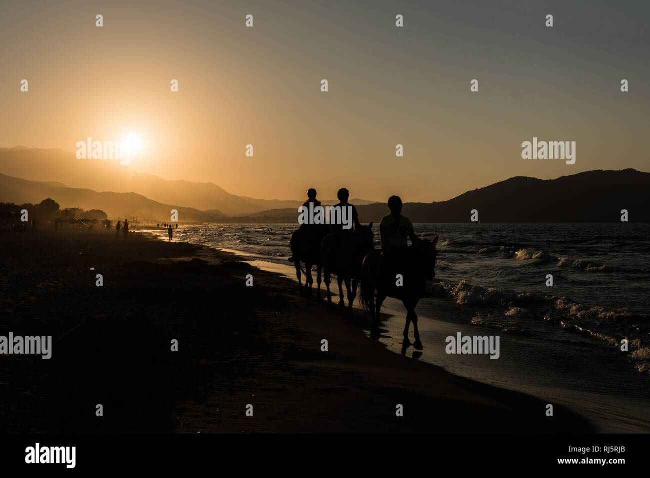 Riding horses at sunset hi-res stock photography and images - Alamy