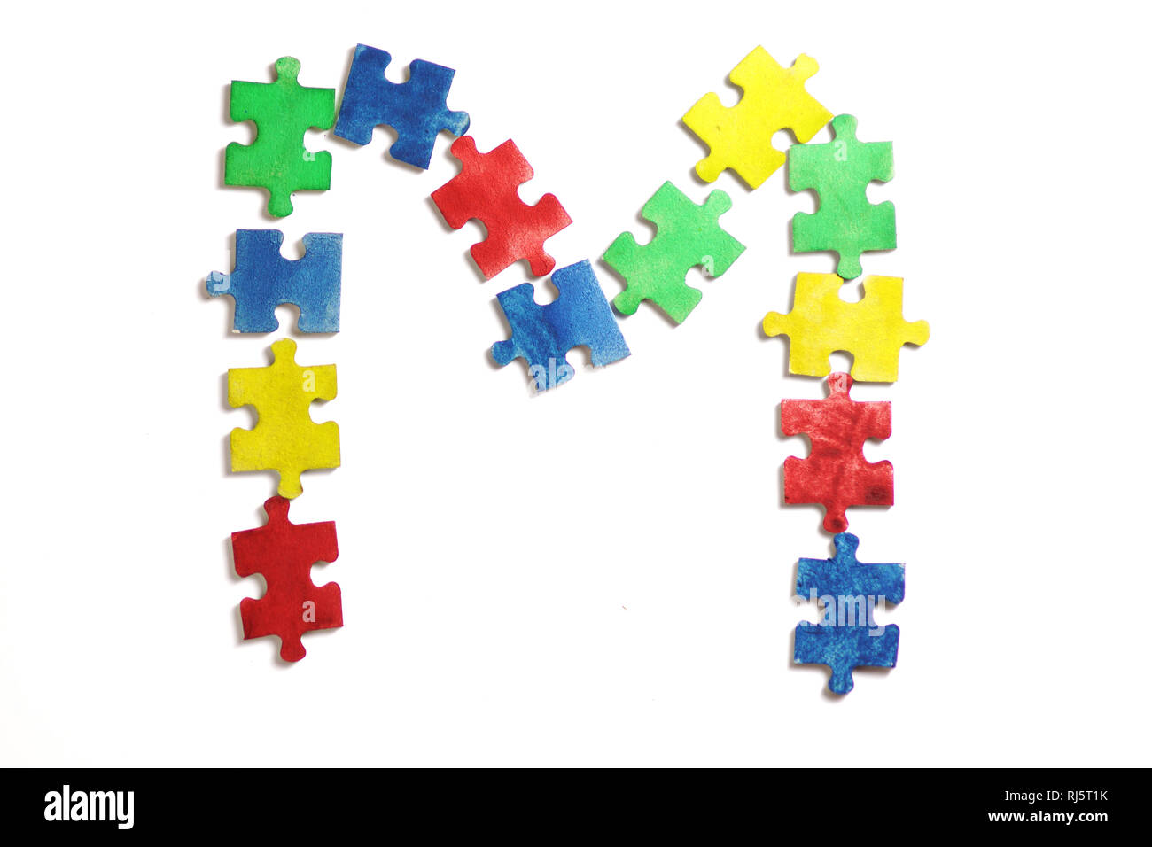 Colourful jigsaw puzzle and alphabet tiles with AUTISM word. Autism ...