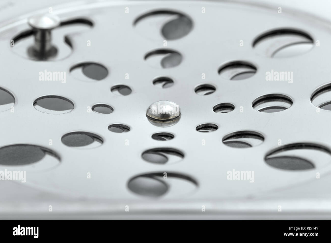 Close up chrome drain isolated on white background Stock Photo - Alamy