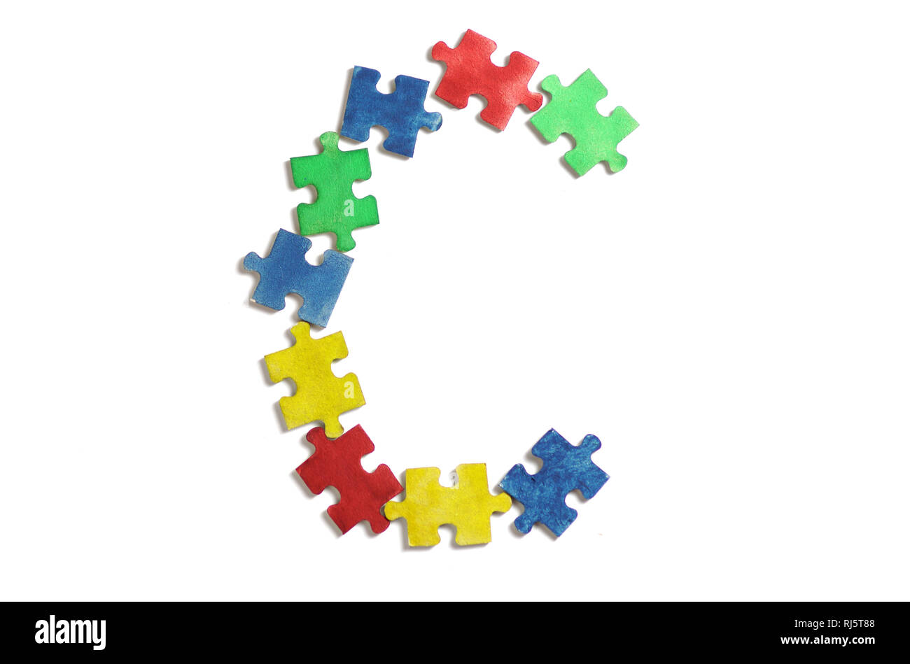 Colourful jigsaw puzzle and alphabet tiles with AUTISM word. Autism ...