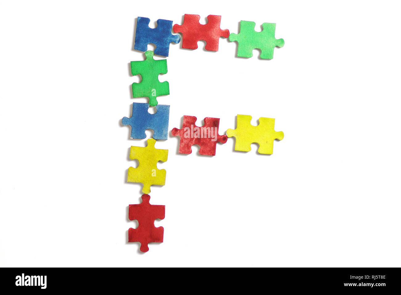 Colourful jigsaw puzzle and alphabet tiles with AUTISM word. Autism ...