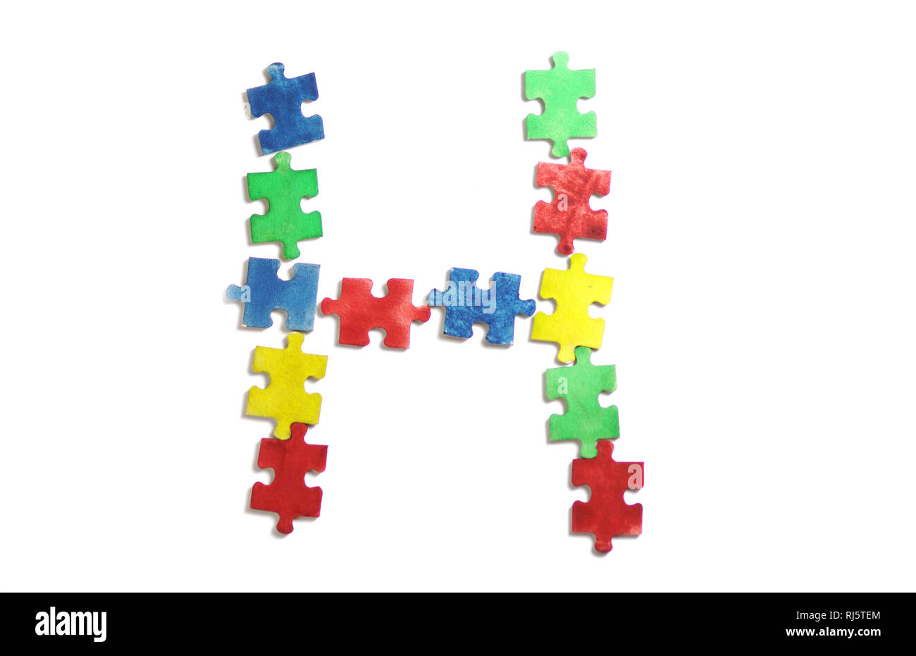 Colourful jigsaw puzzle and alphabet tiles with AUTISM word. Autism ...