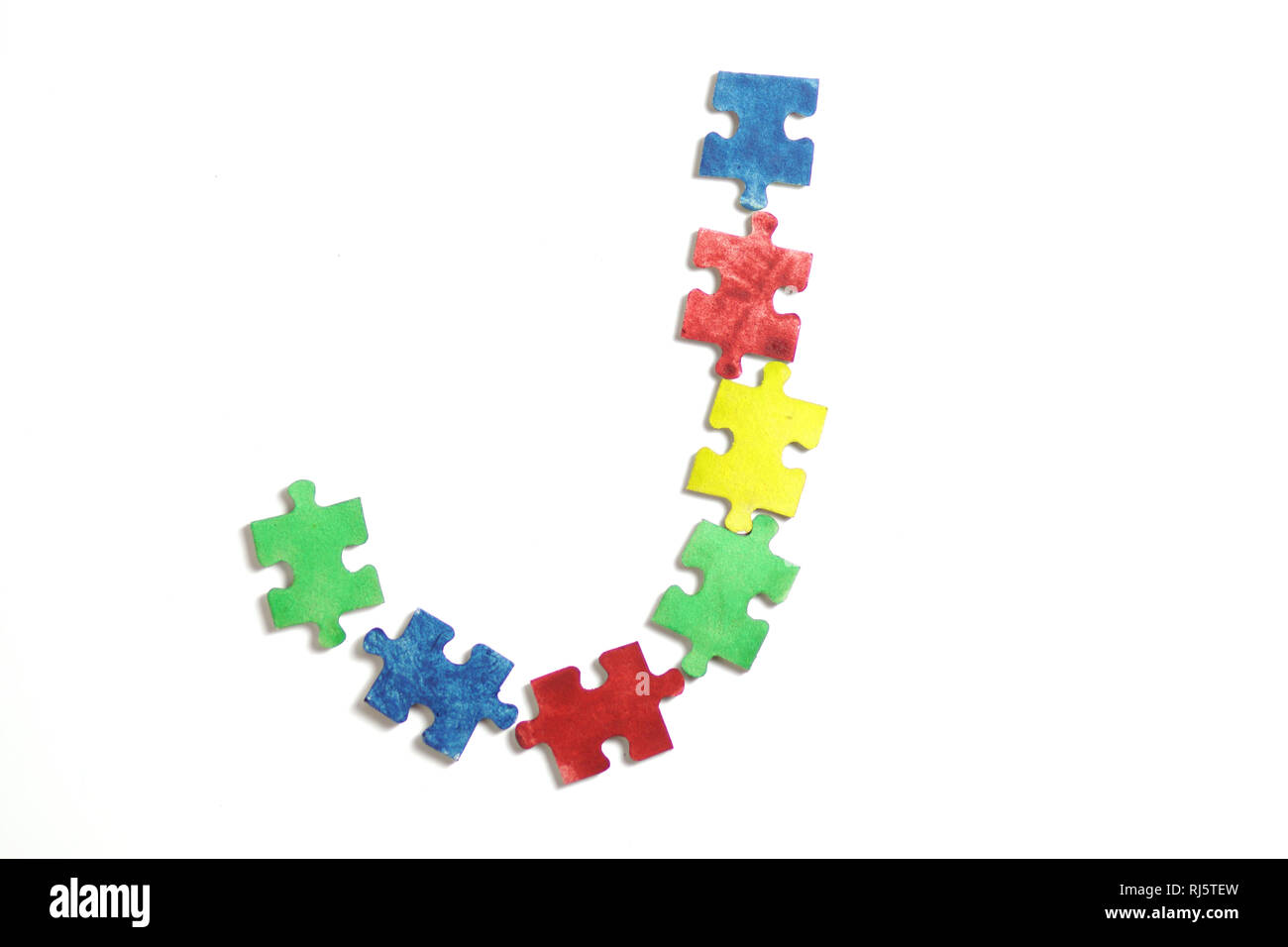 Colourful jigsaw puzzle and alphabet tiles with AUTISM word. Autism ...